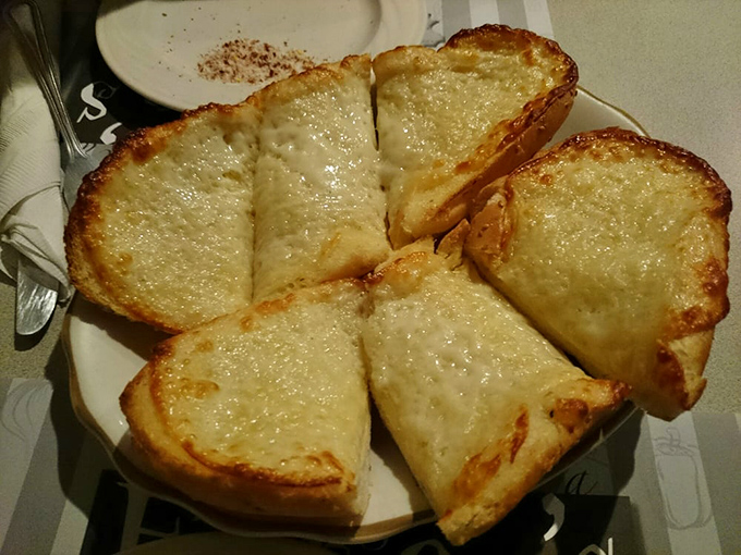 Garlic bread that achieves the impossible trifecta: buttery, crispy edges with a soft center and enough garlic to keep vampires at bay for weeks.