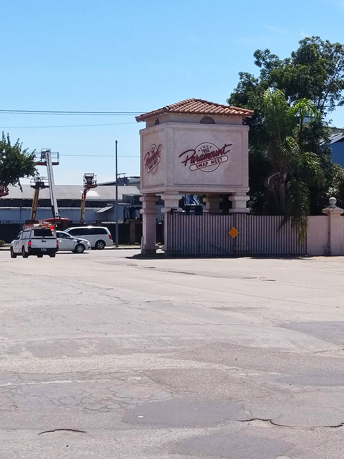 The iconic entrance stands as a gateway to bargain paradise. This Spanish-style archway has welcomed generations of savvy shoppers.