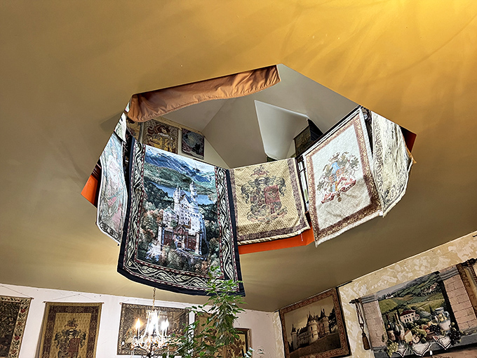 Look up! Tapestries hang from the ceiling in this cleverly designed space where every vertical surface becomes an opportunity for medieval storytelling.