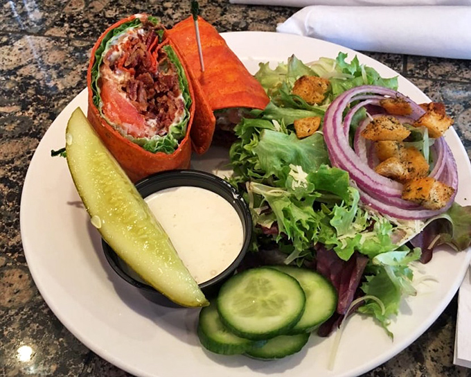 A wrap that's actually worth ordering, accompanied by a salad that doesn't feel like punishment. Balance achieved, deliciously.