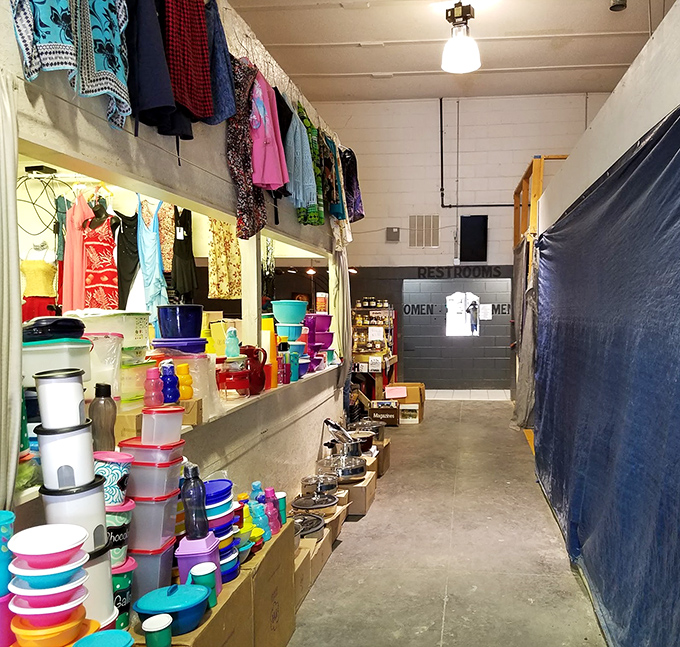 The indoor corridor reveals the organized chaos that makes flea markets magical. From Tupperware to textiles, this hallway leads to discoveries waiting to happen.