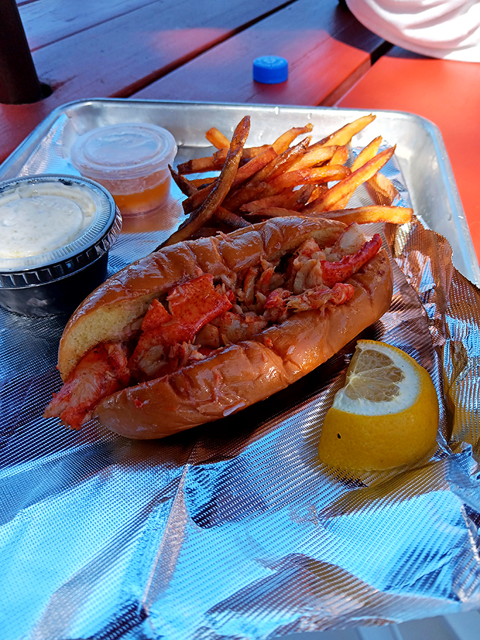 The lobster roll that answers the eternal question: "How much lobster can you legally stuff into a toasted bun before it becomes a felony?"