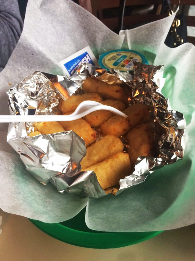 Mac and cheese bites wrapped in foil like the little gifts they are – comfort food elevated to an art form worth sharing.