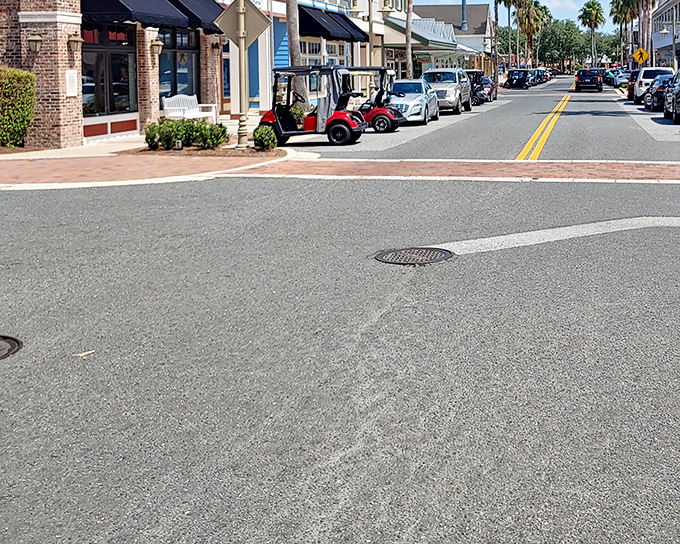 Main Street's perfect blend of cars and golf carts represents The Villages' unique culture&mdash;where traditional transportation meets retirement innovation.