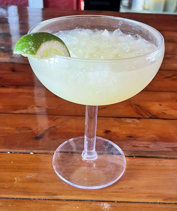 A margarita that promises vacation vibes with every sip. That lime isn't just garnish&mdash;it's an exclamation point on a glass full of "forget your troubles."