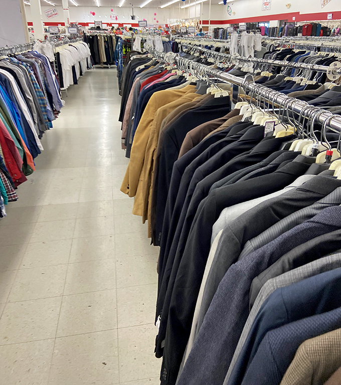 The suit section: where second chances hang in orderly rows. Tomorrow's job interview outfit is here, at yesterday's prices.