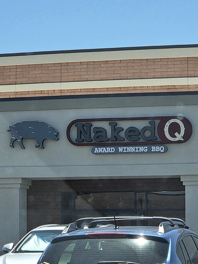 That logo tells you everything you need to know: award-winning barbecue that doesn't hide behind fancy trappings. The pig knows.