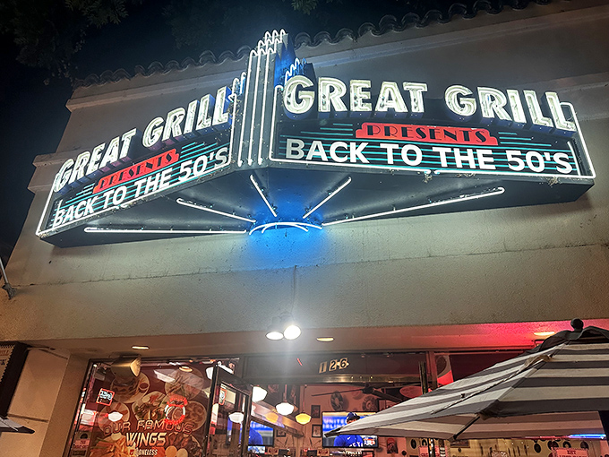 At night, the sign glows like a beacon for hungry time travelers, promising burgers, shakes, and a heavy dose of nostalgia.