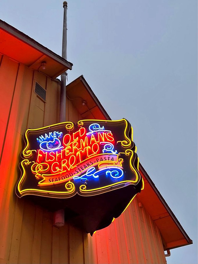 The neon sign glows like a maritime North Star, guiding hungry travelers to what might be the best seafood decision of their California journey.