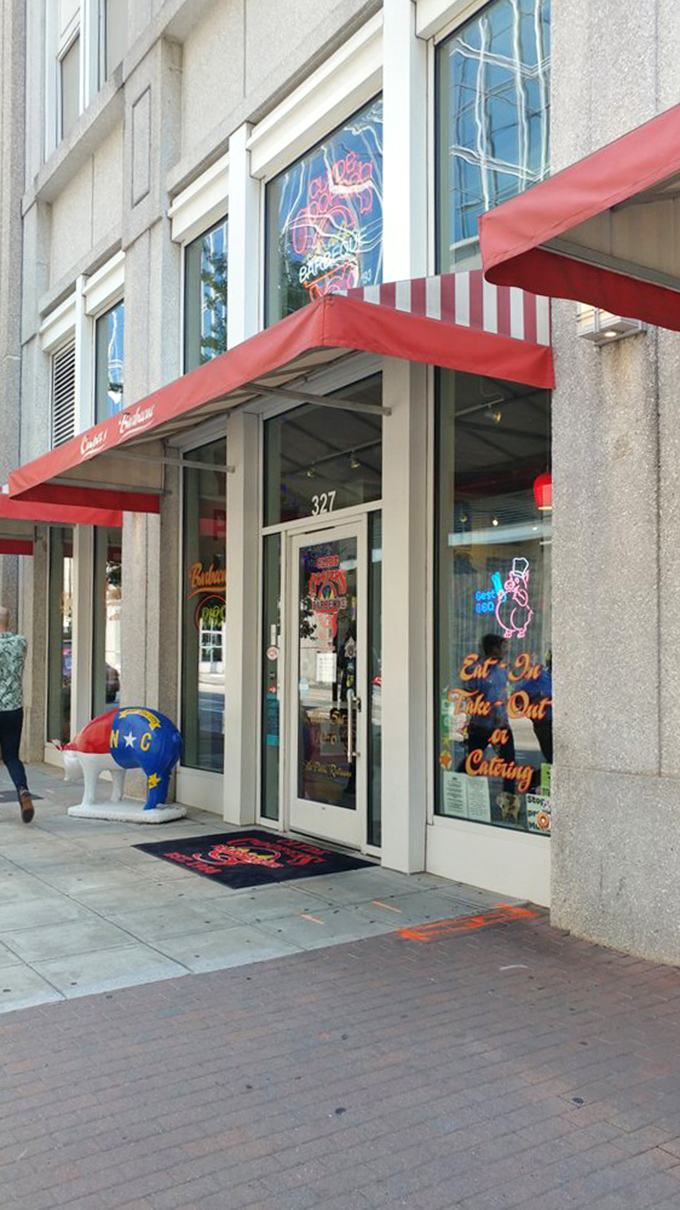 The red awning signals you've found the promised land of pork. That painted pig statue isn't just decoration &ndash; it's a harbinger of the smoky delights waiting inside.