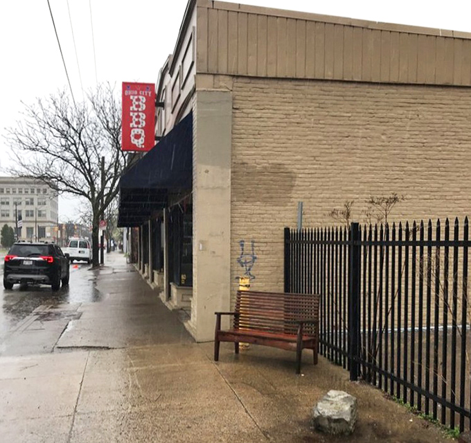 Even on a rainy Cleveland day, that red BBQ sign serves as a beacon of warmth, drawing hungry pilgrims to its smoky sanctuary.