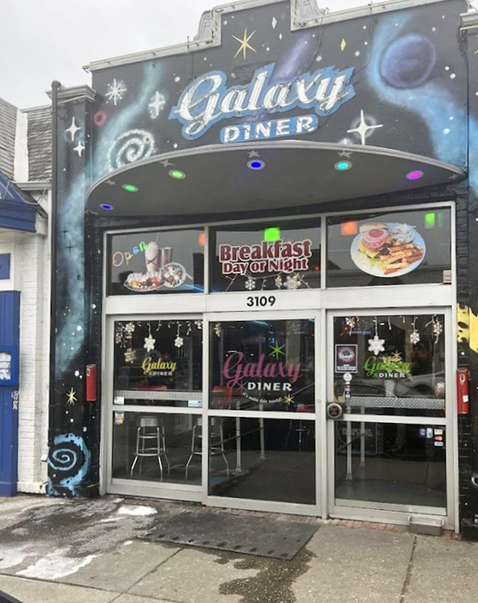 The exterior mural transforms an ordinary storefront into an intergalactic portal. Those painted planets have witnessed countless food pilgrimages.