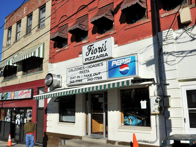 The daytime view reveals Fiori's in its natural habitat&mdash;a neighborhood cornerstone where the awning provides shade for both the building and its reputation.