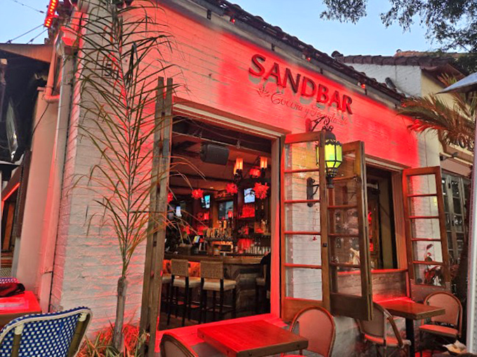 Nighttime at Sandbar glows with possibility and excellent lighting choices. That red illumination isn't just for show—it makes everyone look ten years younger.