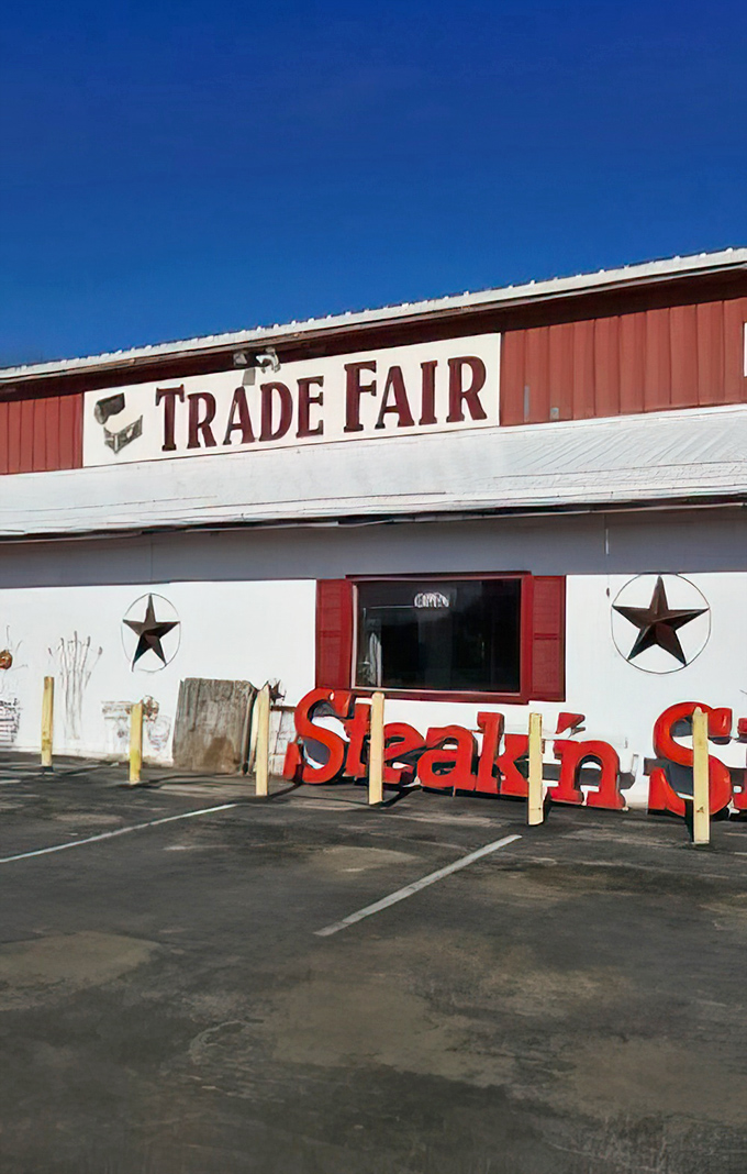 The bold red "TRADE FAIR" sign against a perfect blue Missouri sky&mdash;your beacon to bargain paradise.
