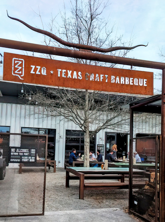The rustic entrance sign stands like a portal to meat paradise. Those longhorns aren't just decoration&mdash;they're a warning: vegetarians proceed with caution.