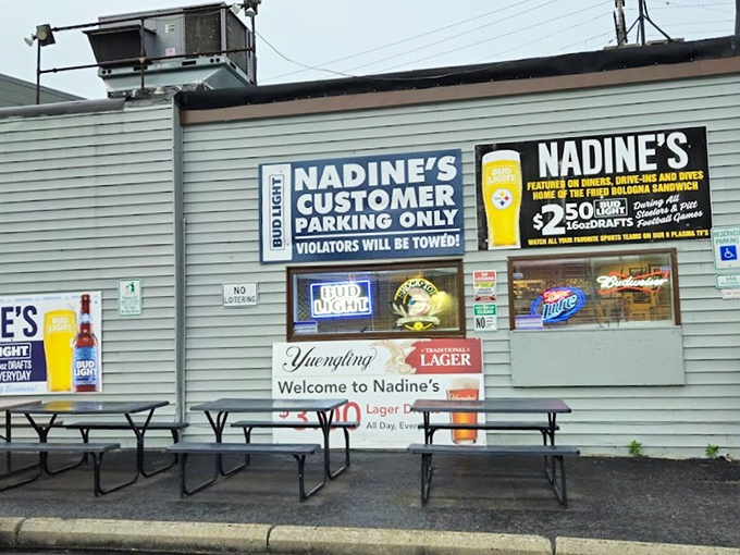 Outdoor seating where Pittsburgh weather permits, with signs that make it clear: this parking lot is for serious eaters only.