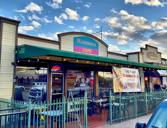 As evening approaches, the caf&eacute;'s exterior takes on a golden glow, much like the perfectly cooked pancakes waiting inside.