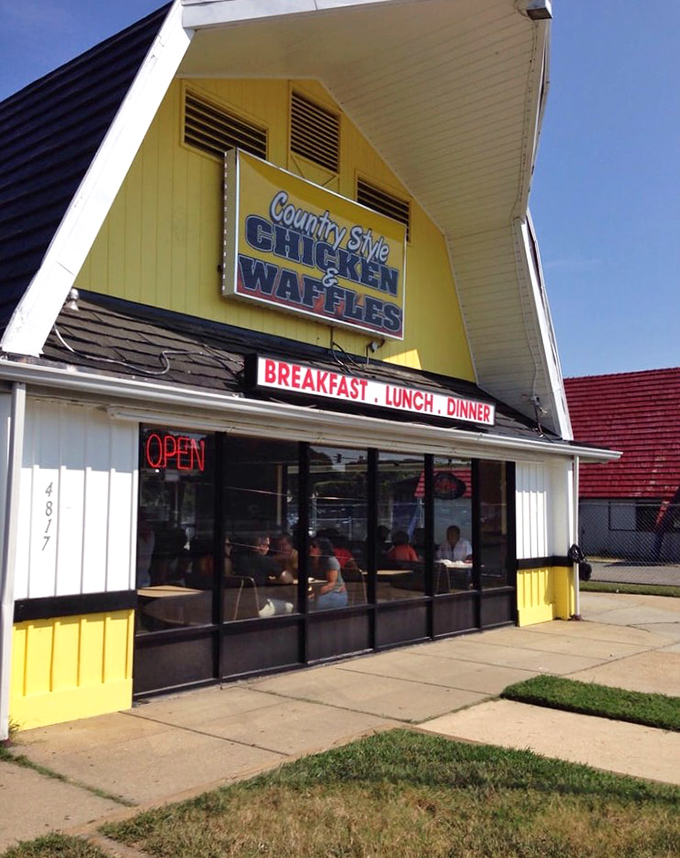 The cheerful yellow exterior is like a preview of the sunny-side-up eggs waiting inside. BREAKFAST-LUNCH-DINNER sign means there's never a wrong time to visit.