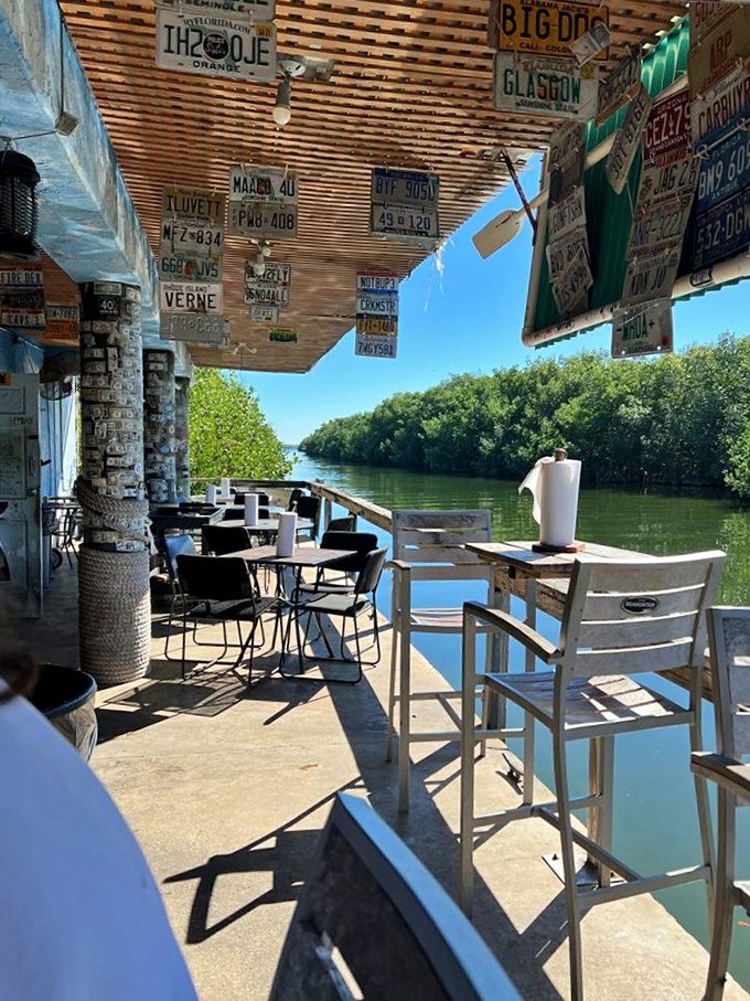License plates from everywhere decorate the ceiling while the water view reminds you exactly where you are – paradise found at the edge of the Keys.