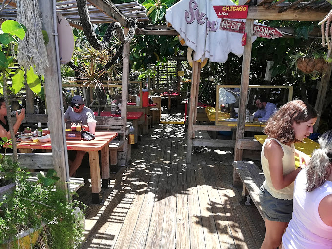 Outdoor dining under swaying palms where every meal becomes a mini-vacation from the ordinary world outside.