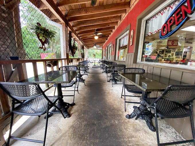 The screened porch offers al fresco dining with Florida practicality. Enjoy your meal with a side of gentle breeze, minus the mosquitoes.