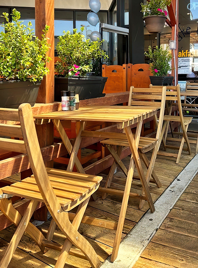 Outdoor seating where California sunshine is a free side dish. These wooden tables have witnessed countless breakfast epiphanies and coffee confessions.