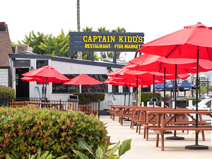 The outdoor seating area, with its cheerful red umbrellas, offers the quintessential SoCal dining experience&mdash;fresh air and fresher seafood.