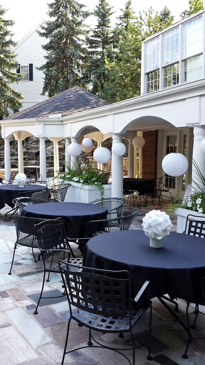 Outdoor dining that makes you feel like you're at a sophisticated garden party. Those white lanterns aren't just decoration&mdash;they're mood setters.