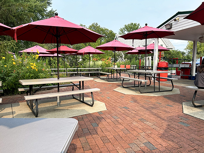 Red umbrellas shade picnic tables on brick pavers where memories are made. Summer in Ohio isn't complete without at least one meal in this garden of simple pleasures.