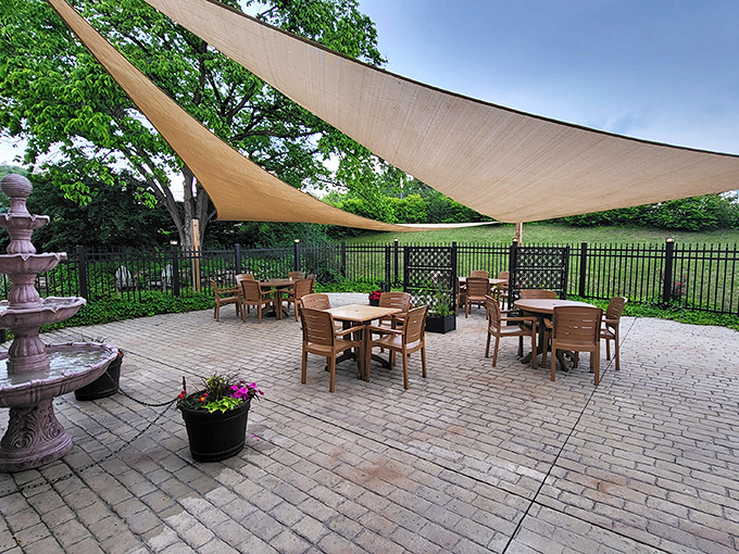 Dine al fresco under canvas sails, with a gentle fountain providing the soundtrack to a meal that tastes even better in the open air.