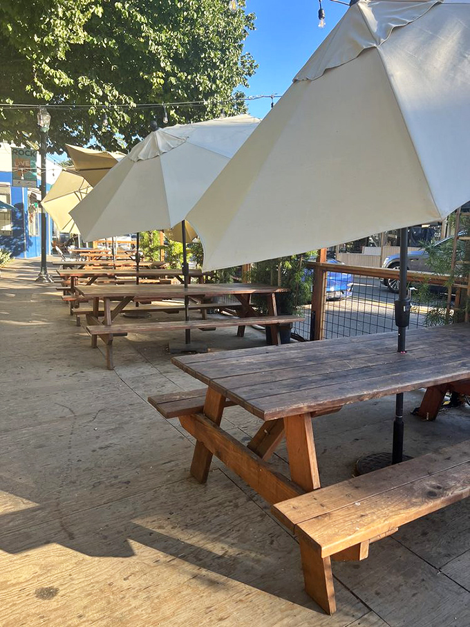 Outdoor seating that invites you to linger under umbrellas, where pizza tastes even better with a side of fresh air.