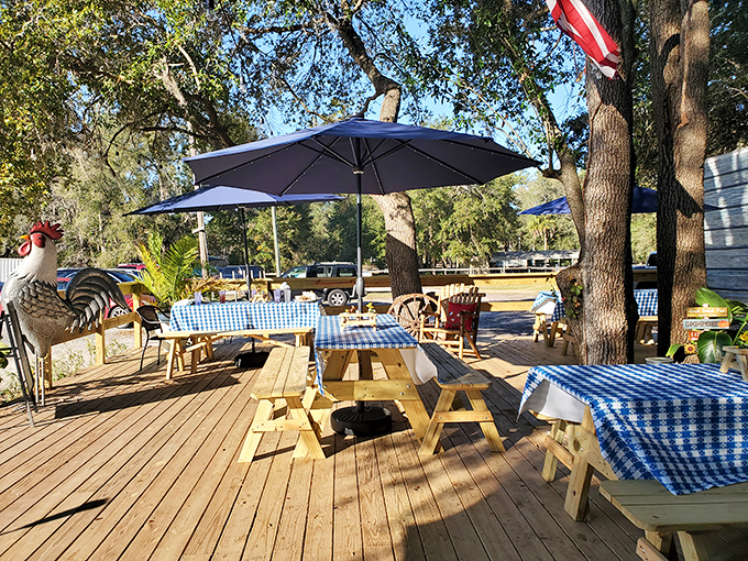 The outdoor dining deck under sprawling oak trees offers the quintessential Florida experience&mdash;enjoying comfort food while gentle breezes rustle through Spanish moss.