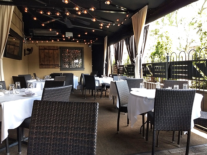 Outdoor dining where string lights create magic and every meal feels like a special occasion.