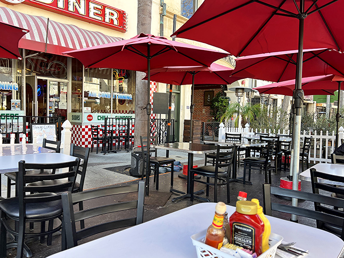 Outdoor seating under red umbrellas offers California sunshine with your meal&mdash;because some pleasures are too good to be contained indoors.