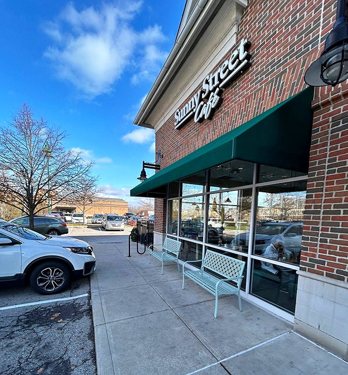 The outdoor entrance beckons with benches that say "the wait is worth it" without saying a word.