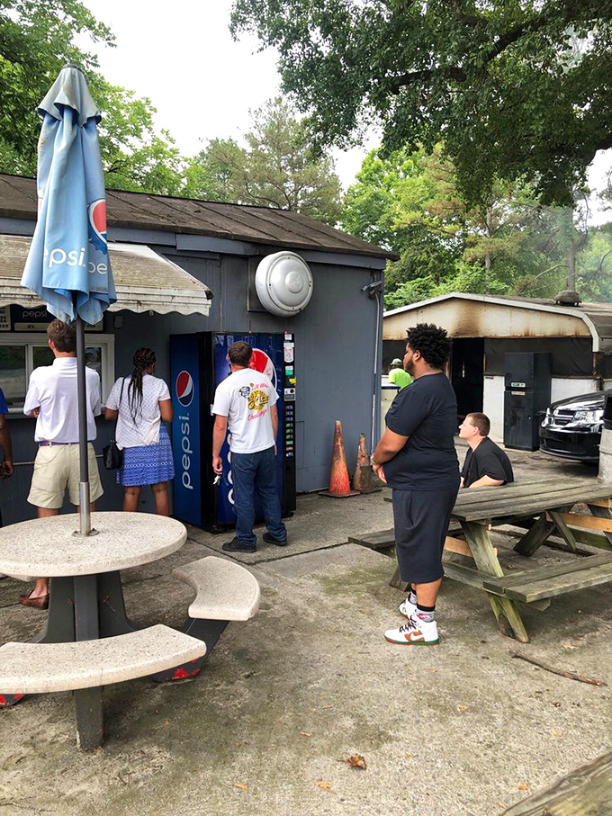 The line forms early, where strangers become friends, united by a common mission: getting their hands on legendary barbecue.