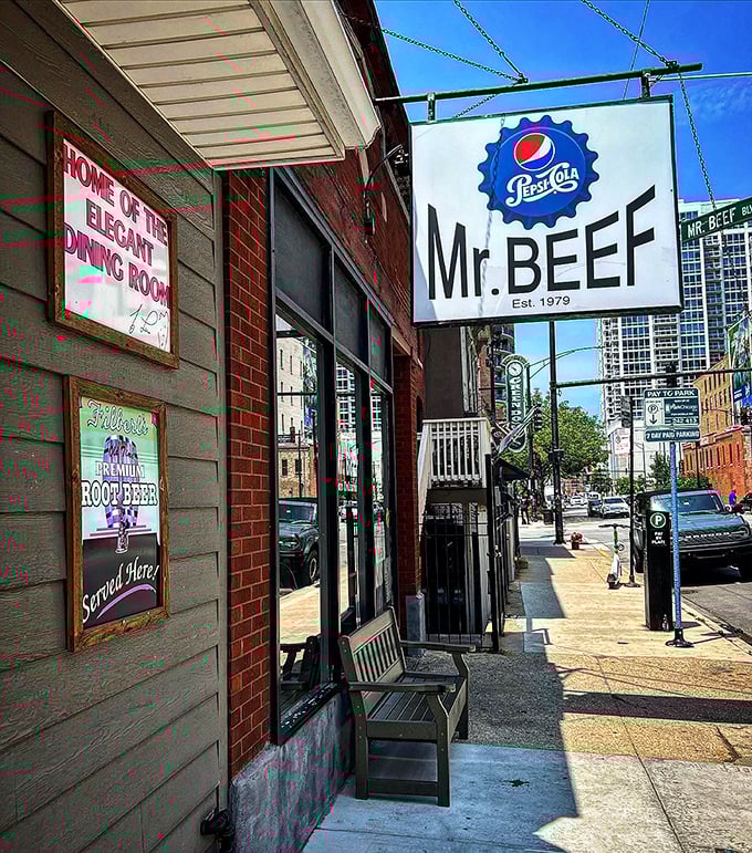 "Home of the Elegant Dining Room" proclaims the sign with delightful irony&mdash;this sidewalk bench is all the ambiance you need.
