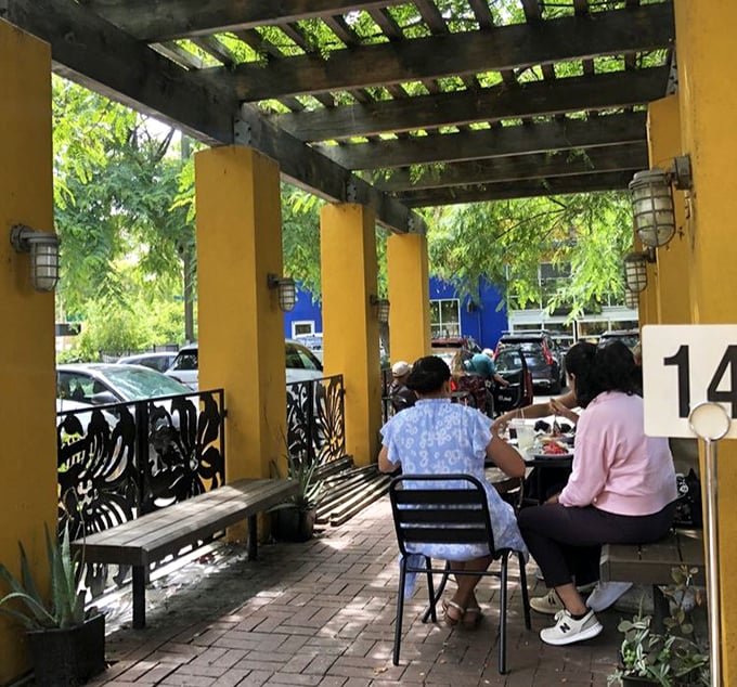 The outdoor patio offers a shaded respite for diners to contemplate the seafood revelations they've just experienced.