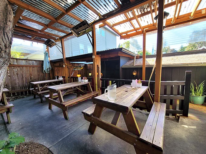 The outdoor patio&mdash;where picnic tables and overhead coverage create nature's perfect breakfast habitat for both sun-seekers and shade-dwellers alike.