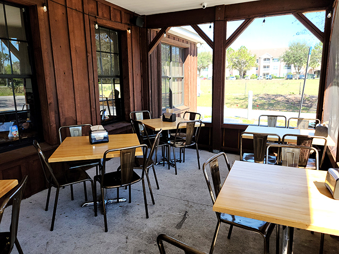 The outdoor seating area offers a tranquil dining alternative. Those wooden beams frame the perfect setting for savoring flavors while soaking up Florida's natural beauty.