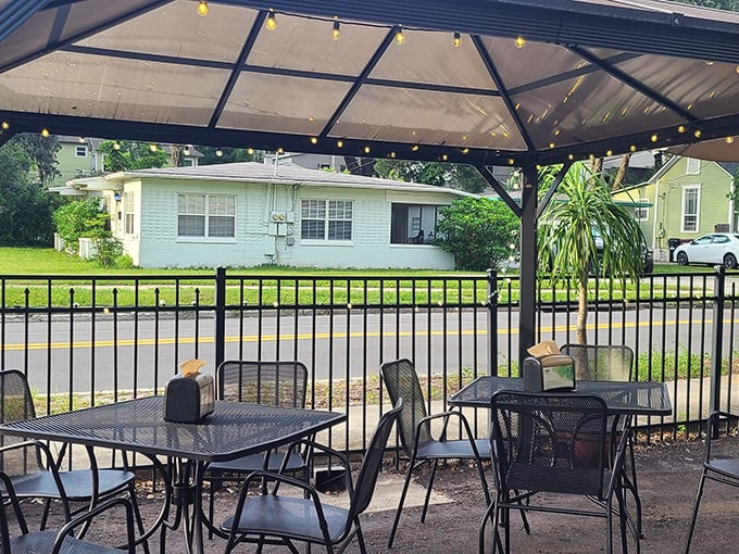 The covered patio &ndash; where Florida's sunshine is tamed just enough to let you enjoy your sandwich in perfect outdoor comfort.