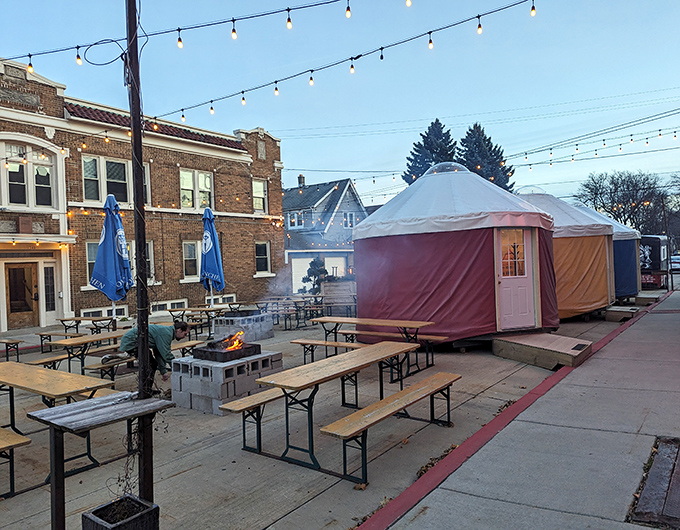 The outdoor beer garden with festive tents &ndash; because sometimes your schnitzel needs fresh air and string lights.