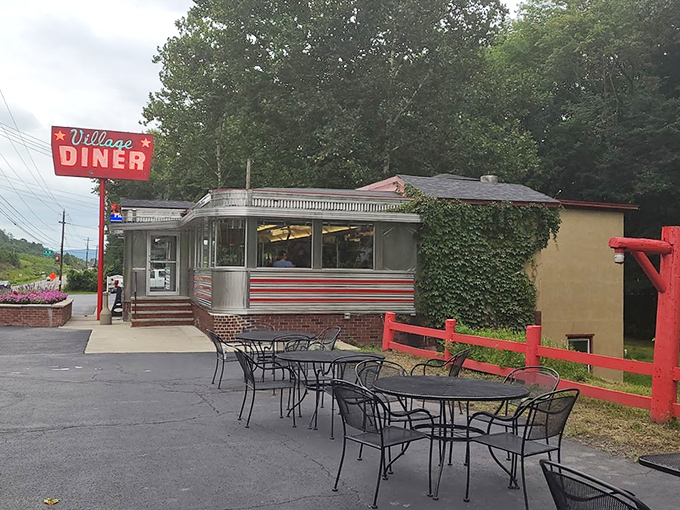 Outdoor seating where summer memories are made. Those red accents against the greenery create the perfect diner atmosphere.