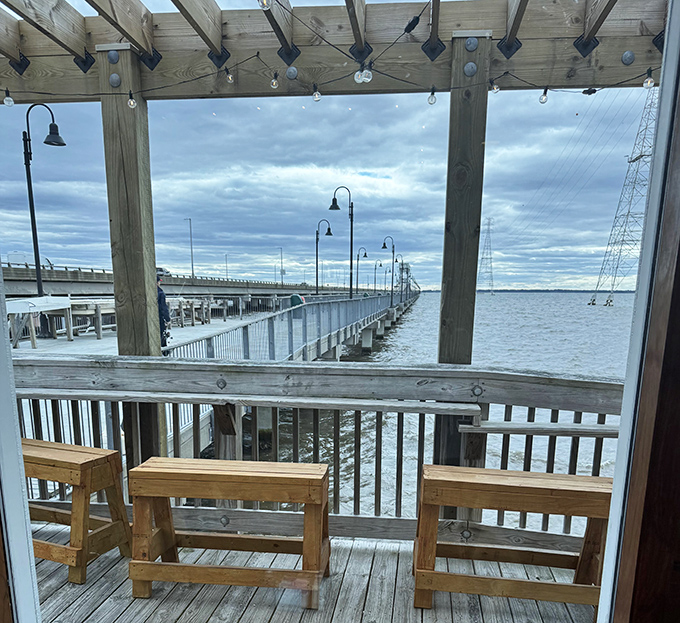 Outdoor seating that turns lunch into an event. The bridge stretching into the distance reminds you how small we are&mdash;better order dessert.