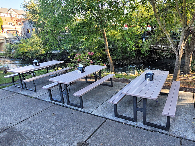 Riverside dining at its most unpretentious. These picnic tables have hosted countless summer meals where the only thing better than the view is the food.