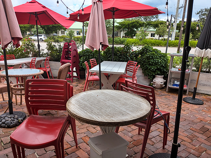 The brick patio with its cherry-red chairs invites you to savor your breakfast al fresco, because eggs Benedict tastes even better with sunshine.