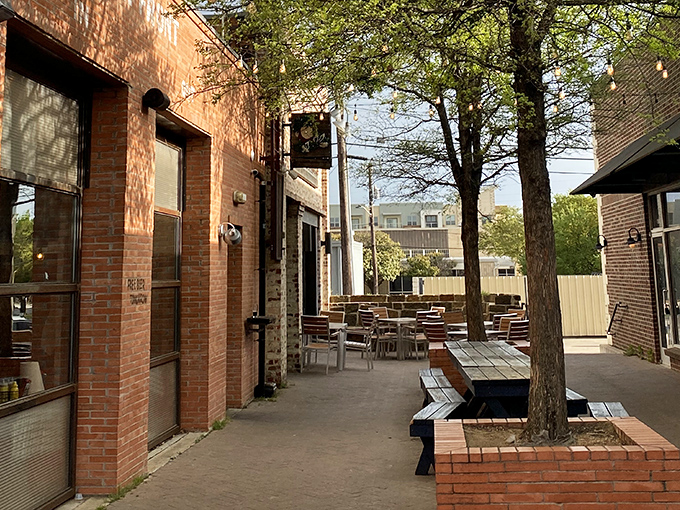 The outdoor seating area offers a breath of fresh air between bites. Those trees have witnessed countless first dates, celebrations, and food comas.