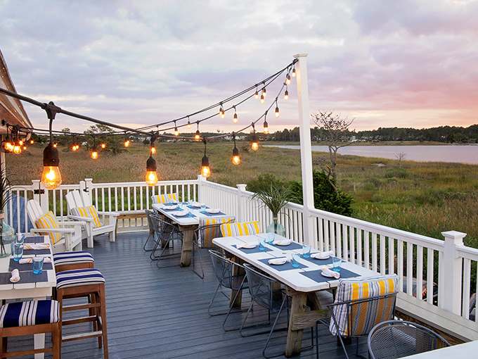 String lights and water views transform simple dining into something resembling pure coastal magic.