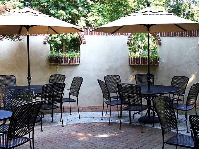 These shaded outdoor tables are where summer afternoons stretch lazily into evening, one crab cake at a time.